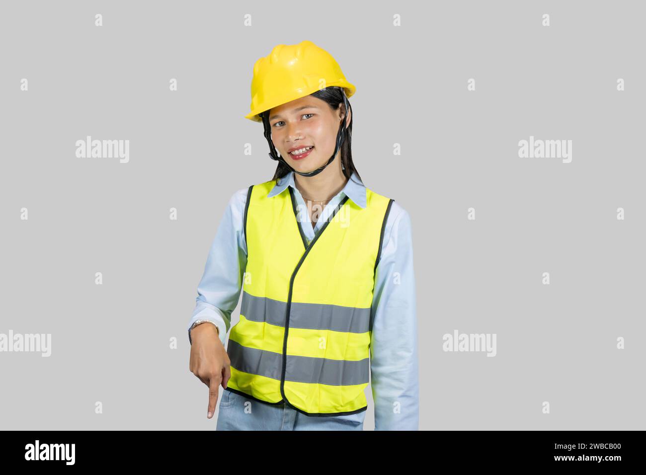 Female Indian Nepali Asian Construction Worker and Engineer giving ...