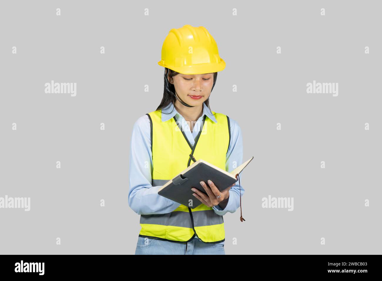 Indian Nepalese Asian Construction Engineer with chartboard and ...