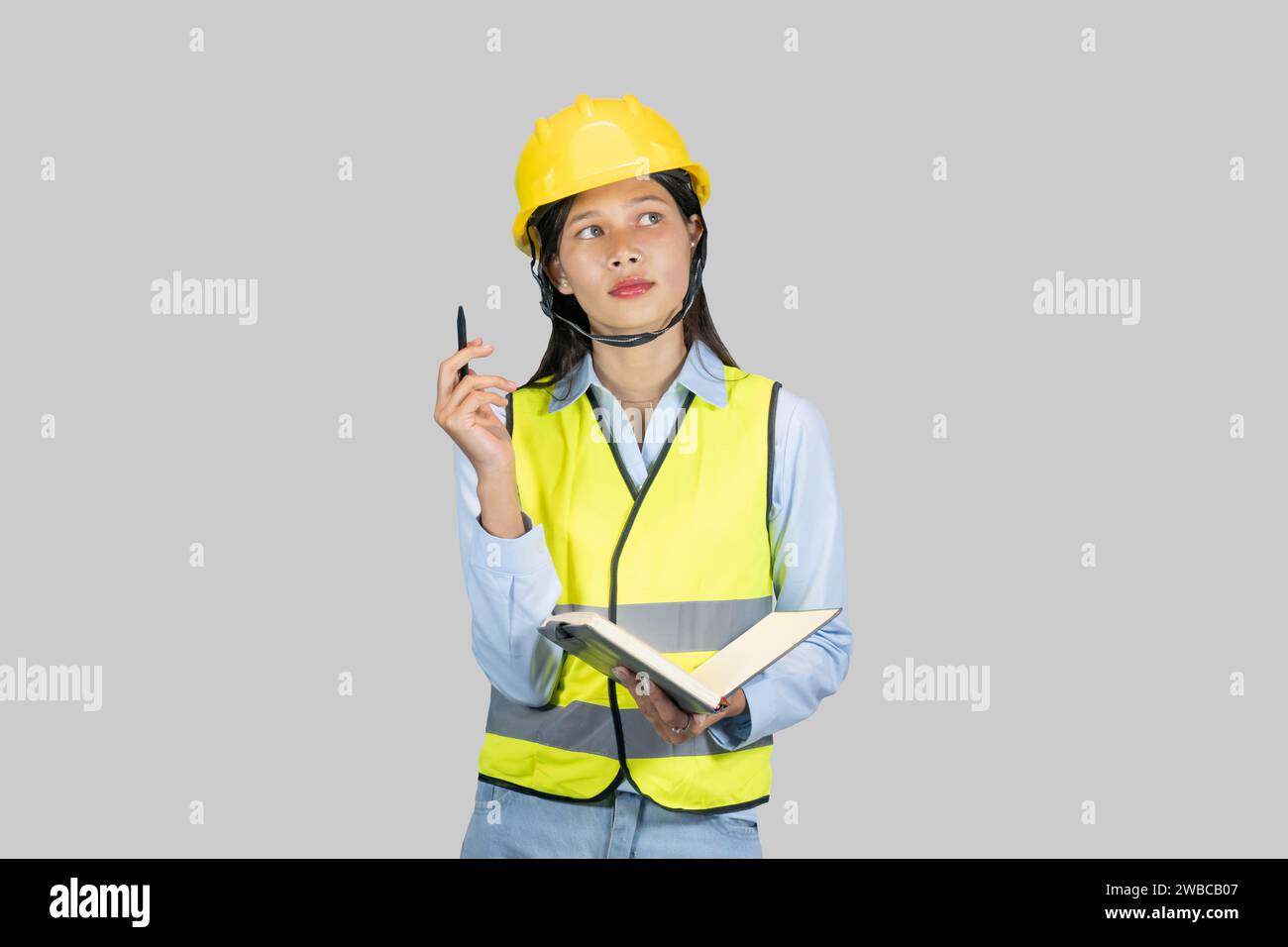 Indian Nepalese Asian Construction Engineer with chartboard and ...