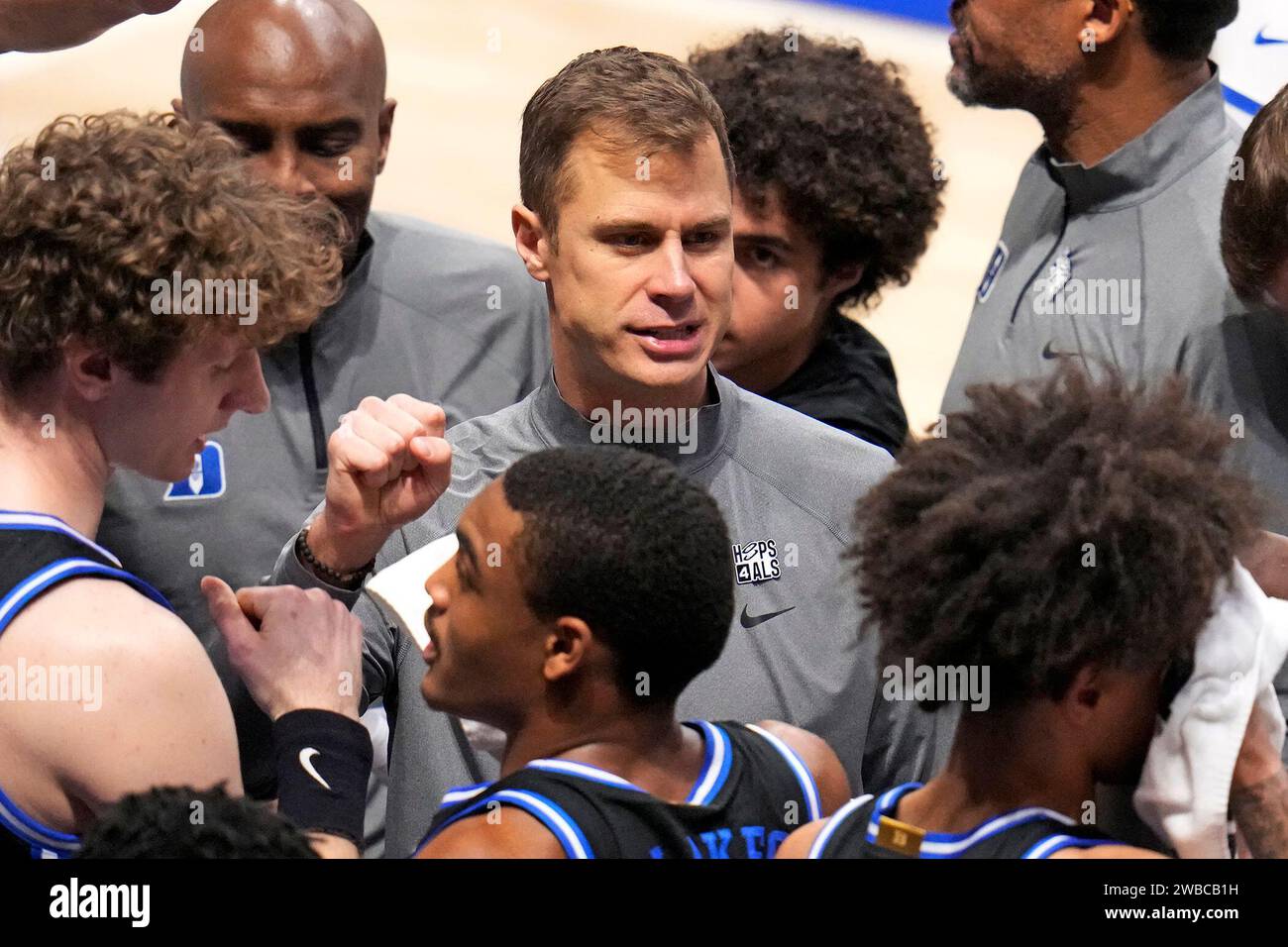 Duke head coach Jon Scheyer, center, gathers his team during a second ...