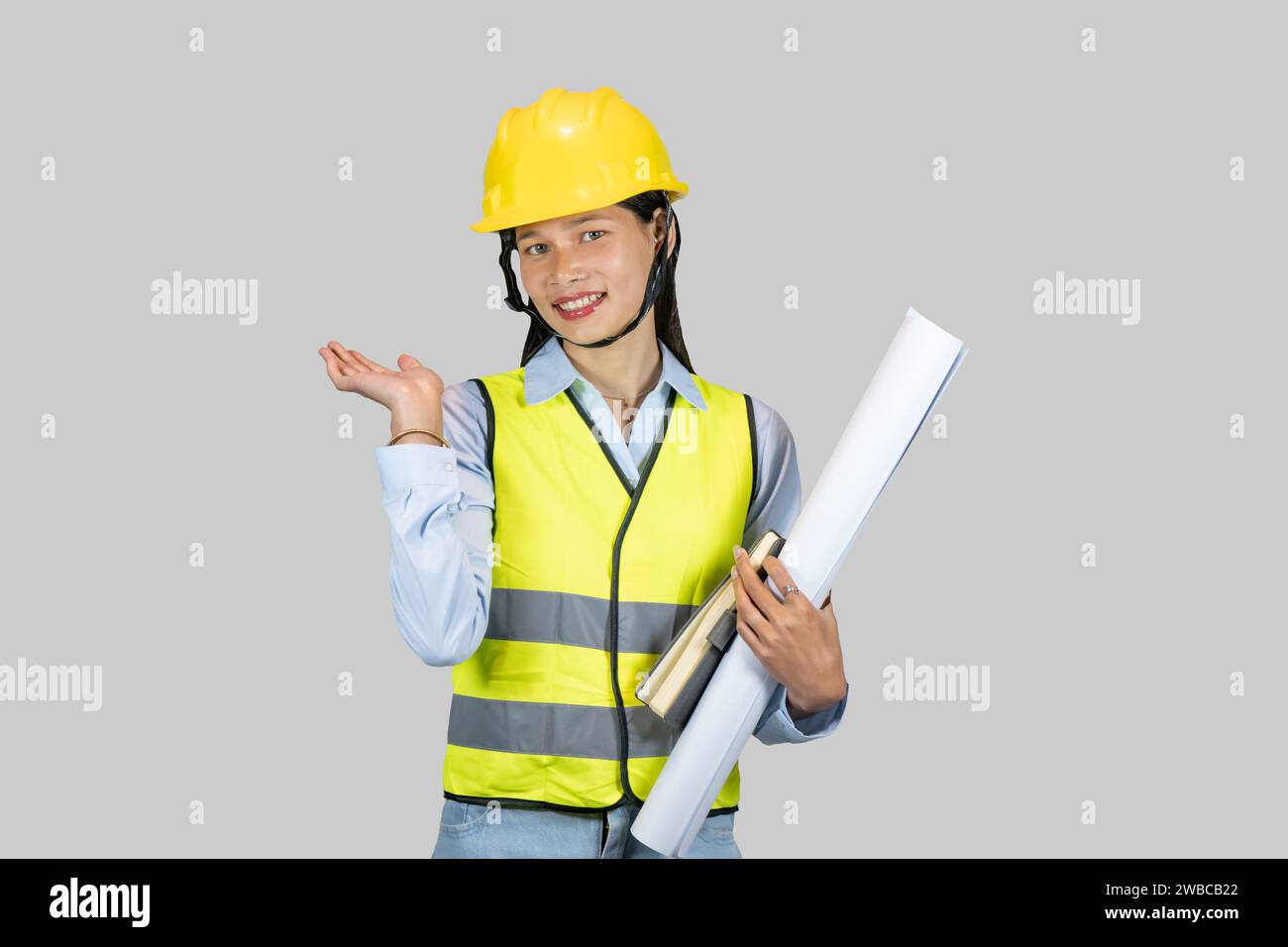 Indian Nepalese Asian Construction Engineer with chartboard and ...