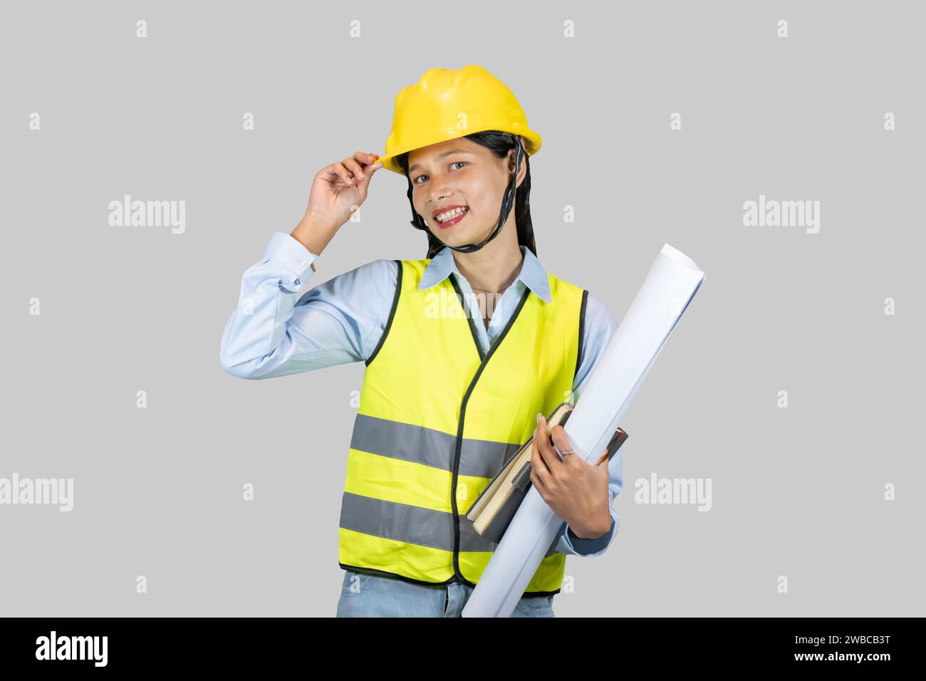 Indian Nepalese Asian Construction Engineer with chartboard and ...
