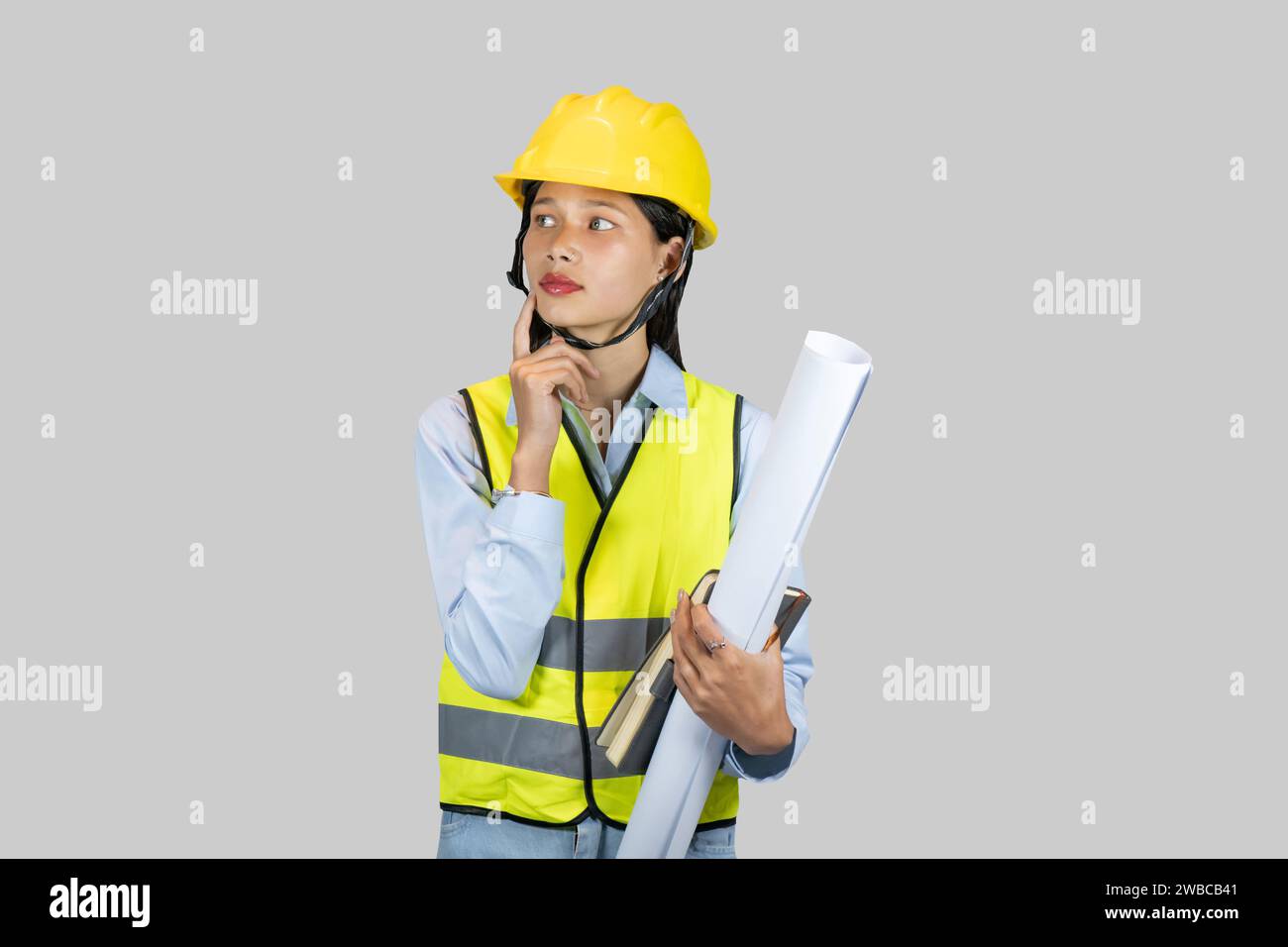 Indian Nepalese Asian Construction Engineer with chartboard and ...