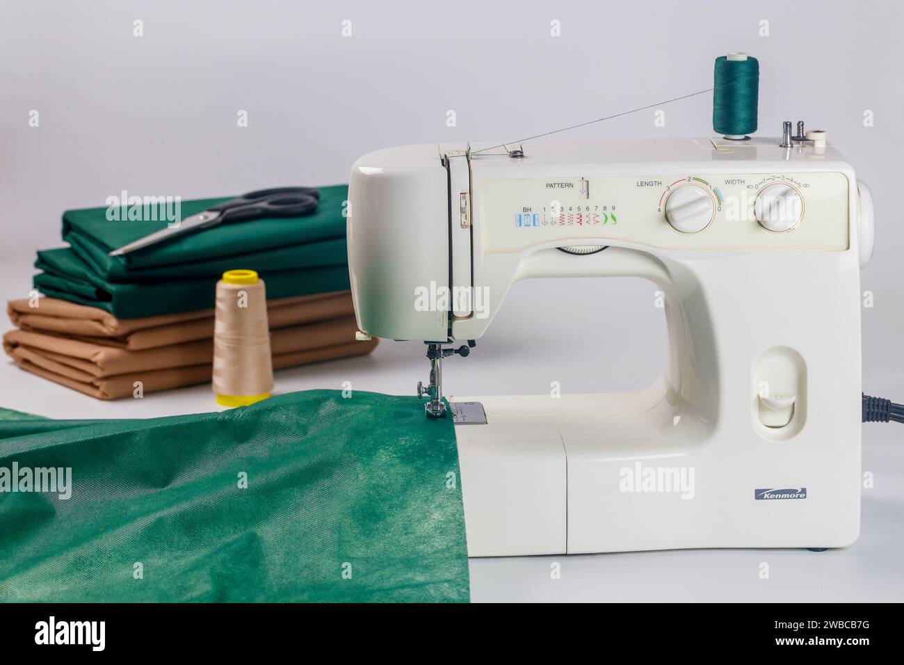 Fabric and thread are attached to sewing machine Kenmore Stock Photo ...