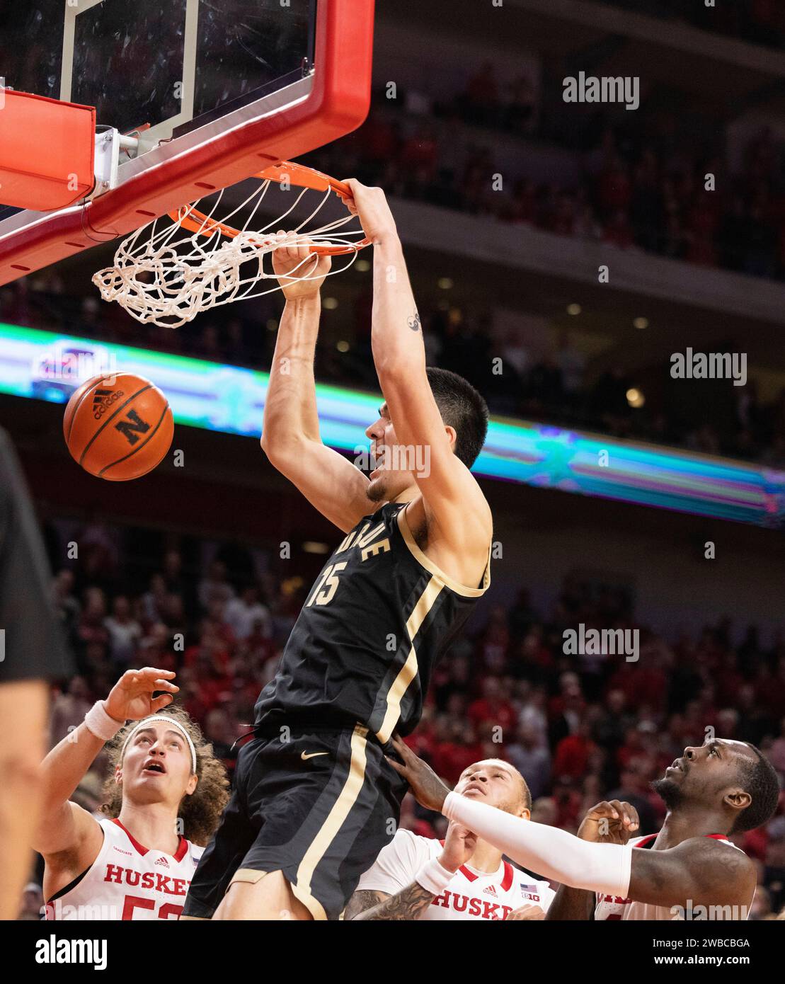 Purdue's Zach Edey dunks over Nebraska's Josiah Allick, C.J. Wilcher ...