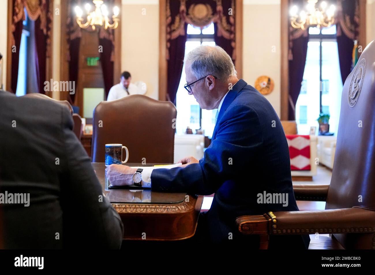 Washington Gov. Jay Inslee prepares in his office before his State of ...