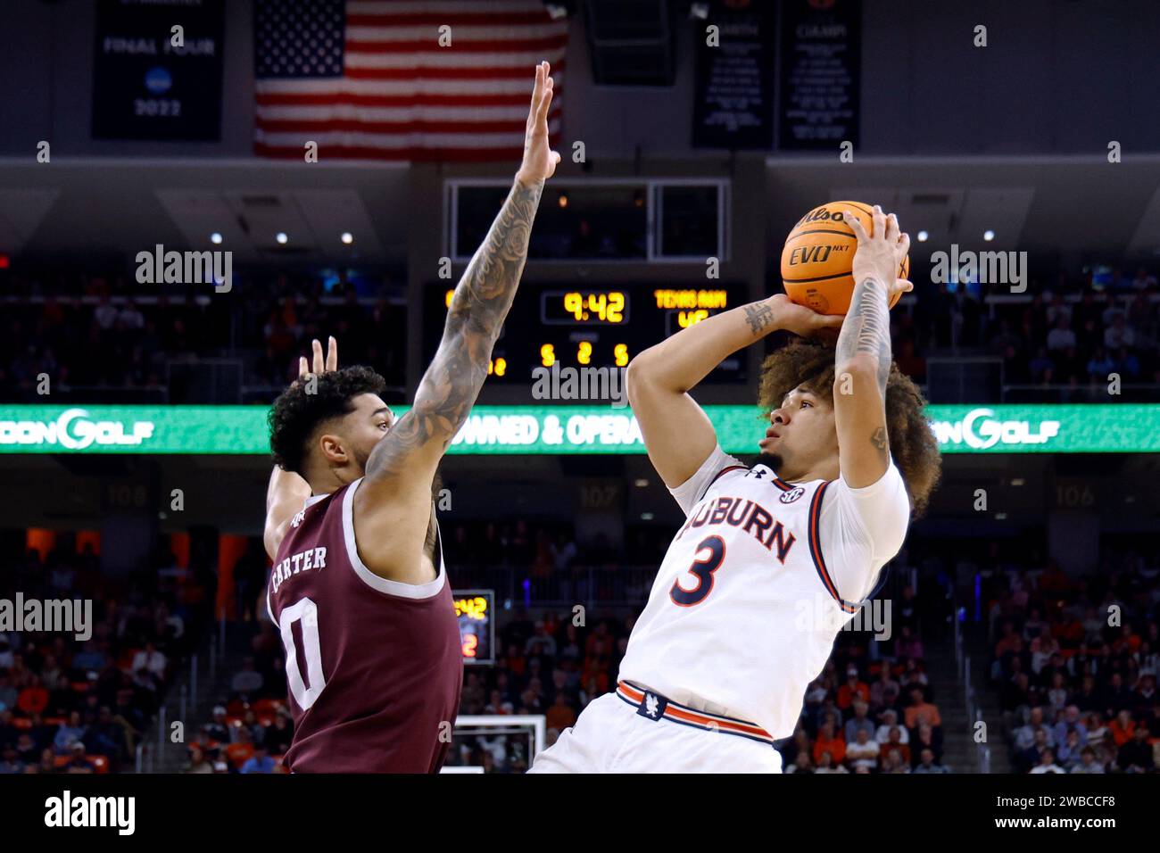 Auburn guard Tre Donaldson (3) shoots over Texas A&M guard Jace Carter ...