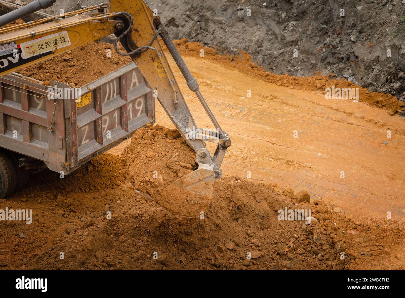 Excavator digging the land Stock Photo - Alamy