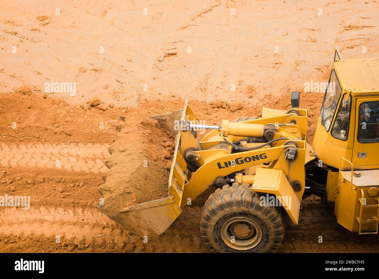 Excavator digging the land Stock Photo - Alamy