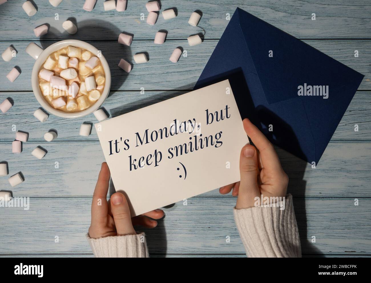 IT'S MONDAY, BUT KEEP SMILING text Female hands holding card with white ...