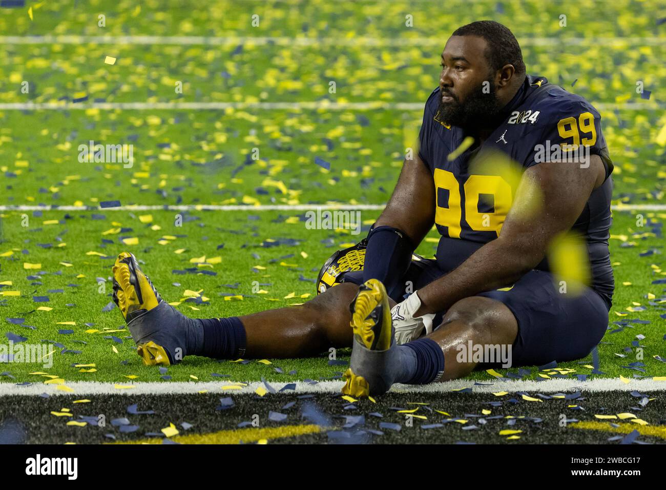 Michigan Wolverines defensive lineman Cam Goode (99) sits on the field ...