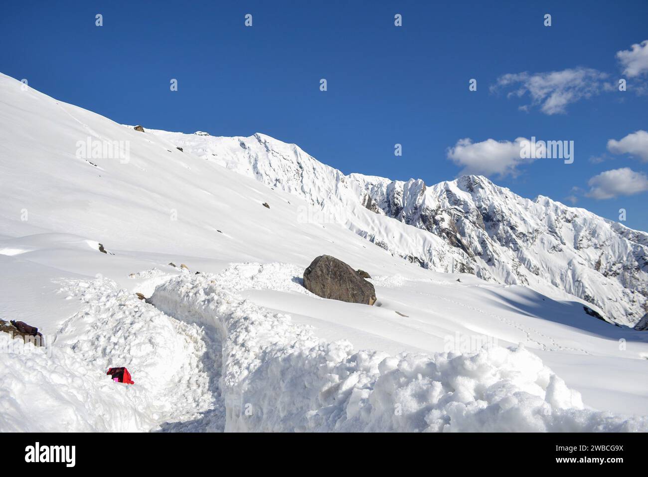 Snow-covered Kedarnath temple route in Himalaya. Kedarnath is a town in ...