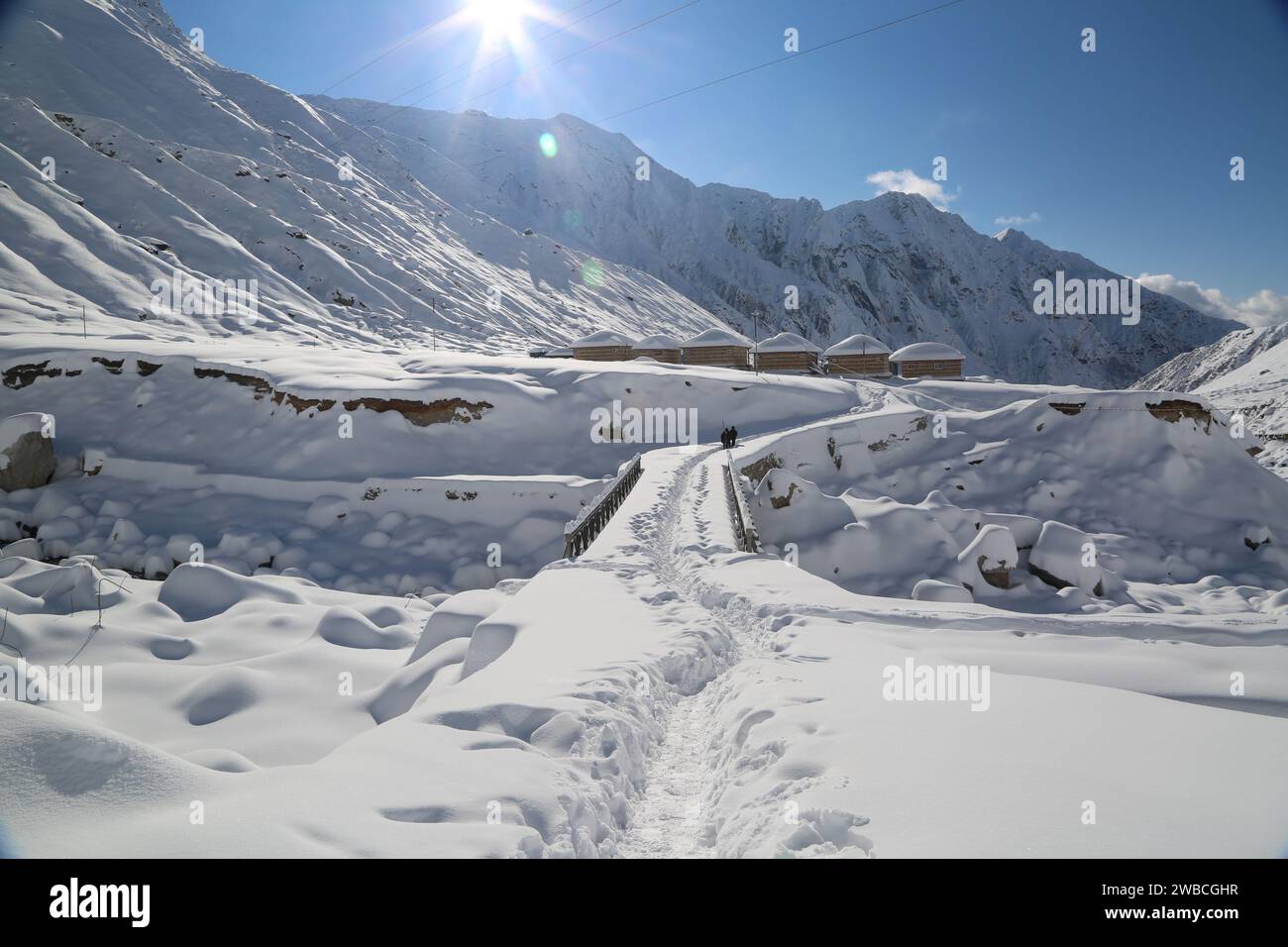 Snow covered mountain peaks and sunrise in Himalaya. Dotted with long ...
