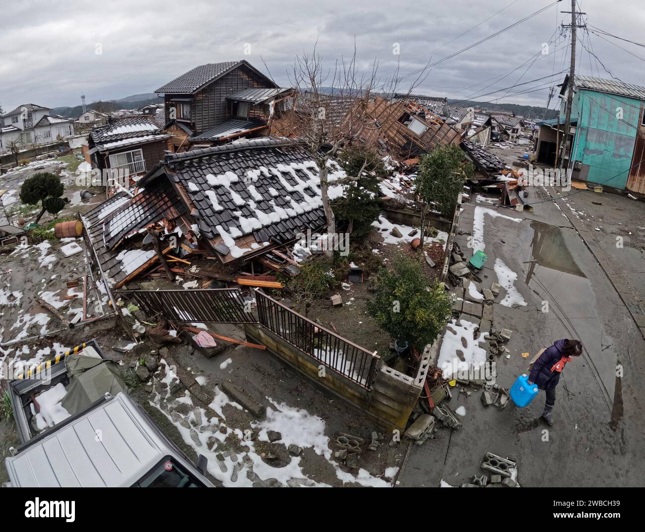 Collapsed buildings are seen at a disaster area in Suzu City, Ishikawa ...