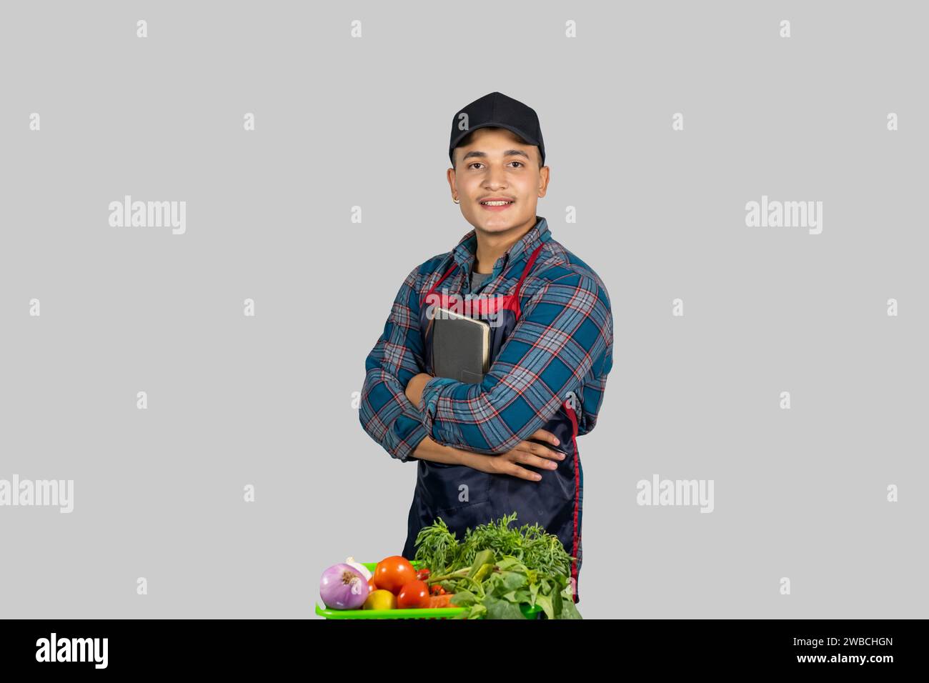 Young Asian Agriculture Vegetable Farmer with notebook giving ...