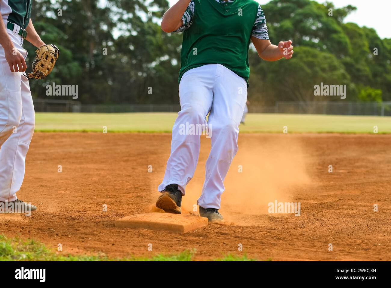 Baseball game, running bases. Runner steals the third base during the ...