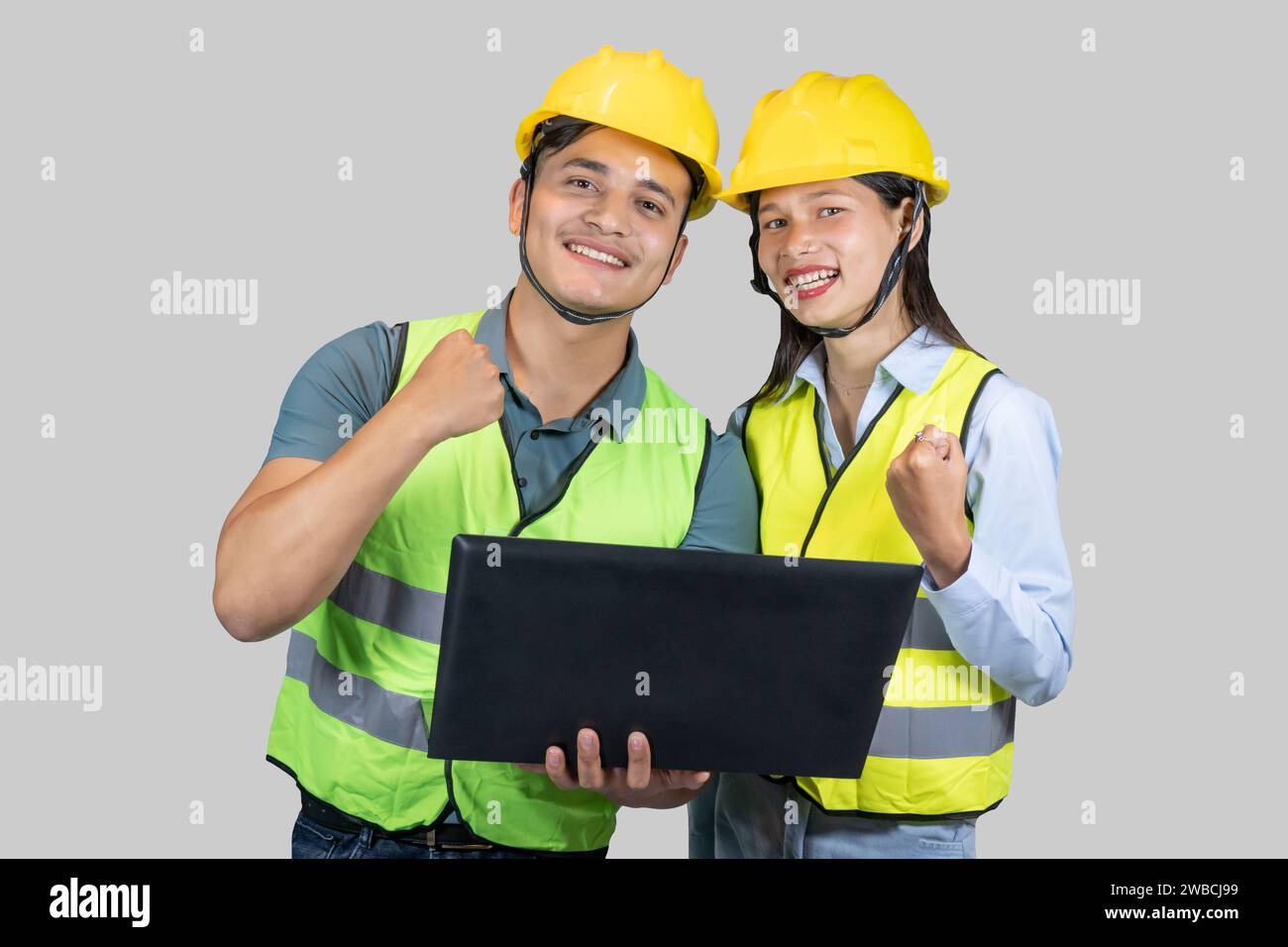 Asian Couple Engineer & Architect gives gestures and expressions on construction field with ...