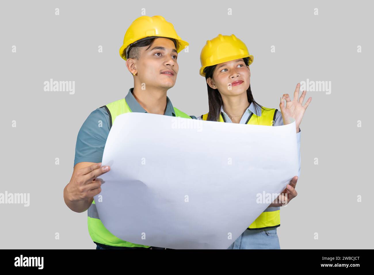 Asian Couple Engineer and Architect giving gestures and expressions on ...