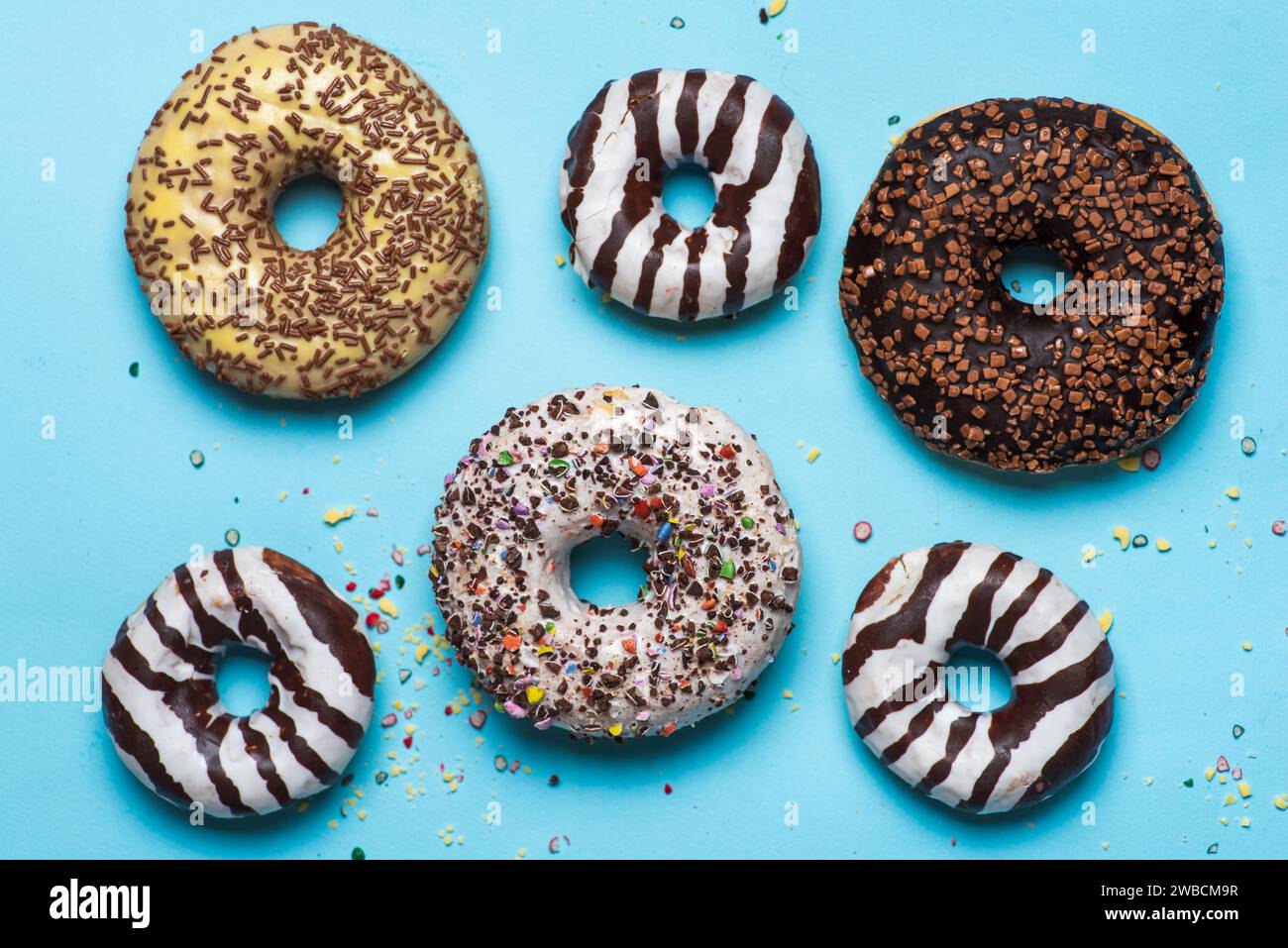 Set of several different delicious, sweet donuts with glaze, chocolate ...