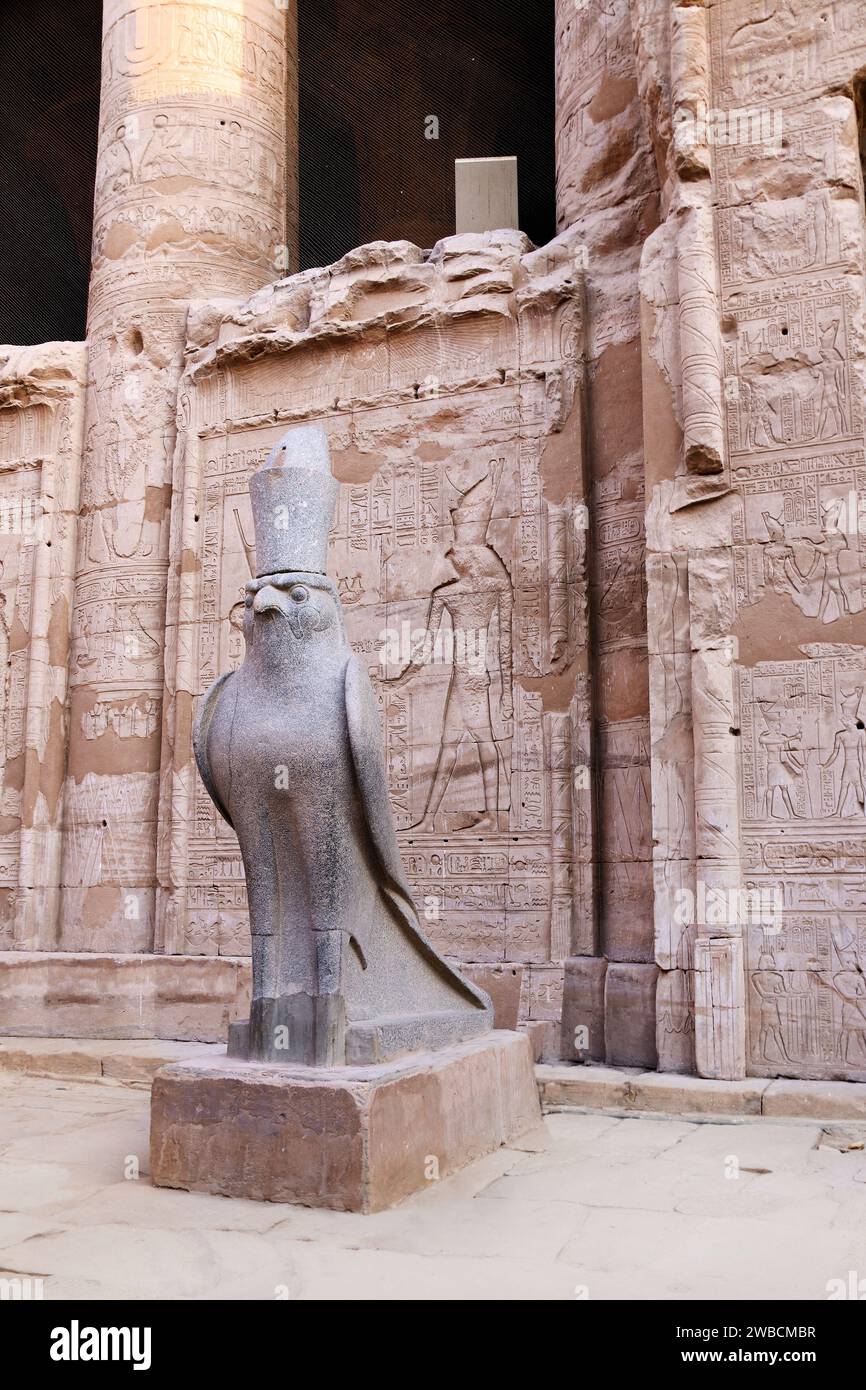 Granite statue of God Horus falcon at entrance Temple of Horus, Edfu ...