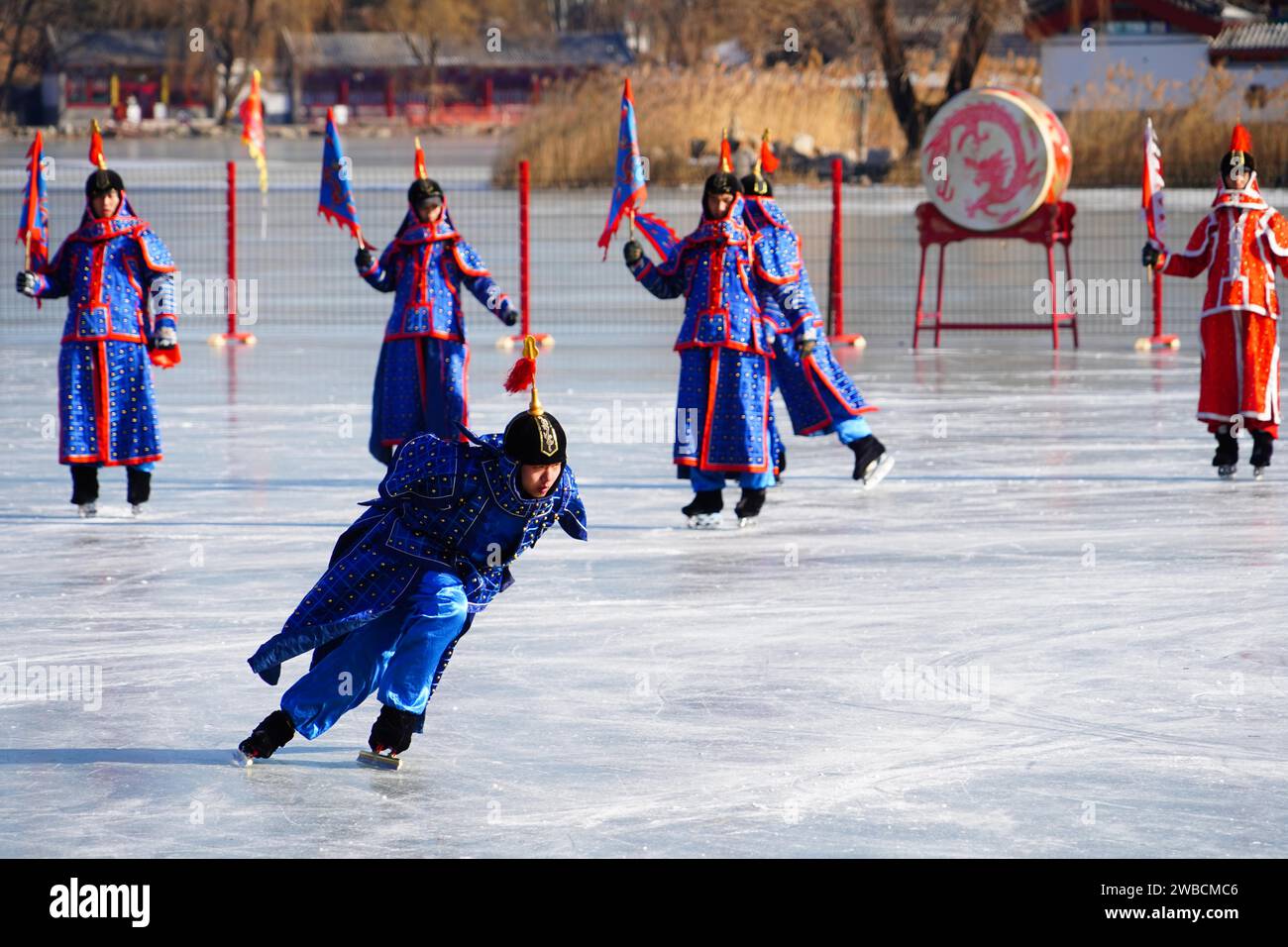 Performers dance on the ice rink in the Old Summer Palace in Beijing ...