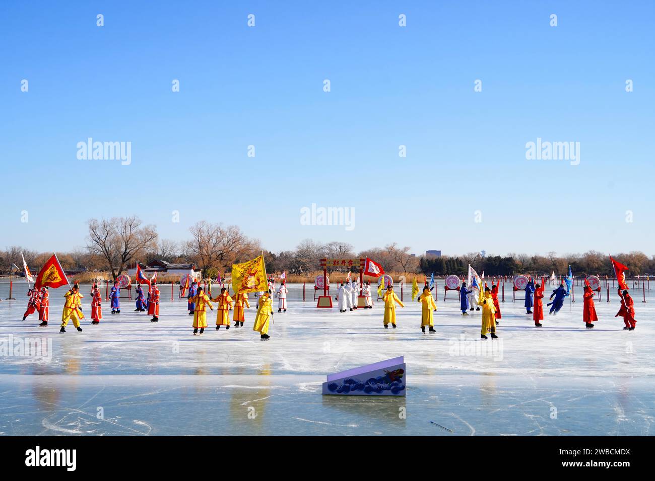 Performers dance on the ice rink in the Old Summer Palace in Beijing ...