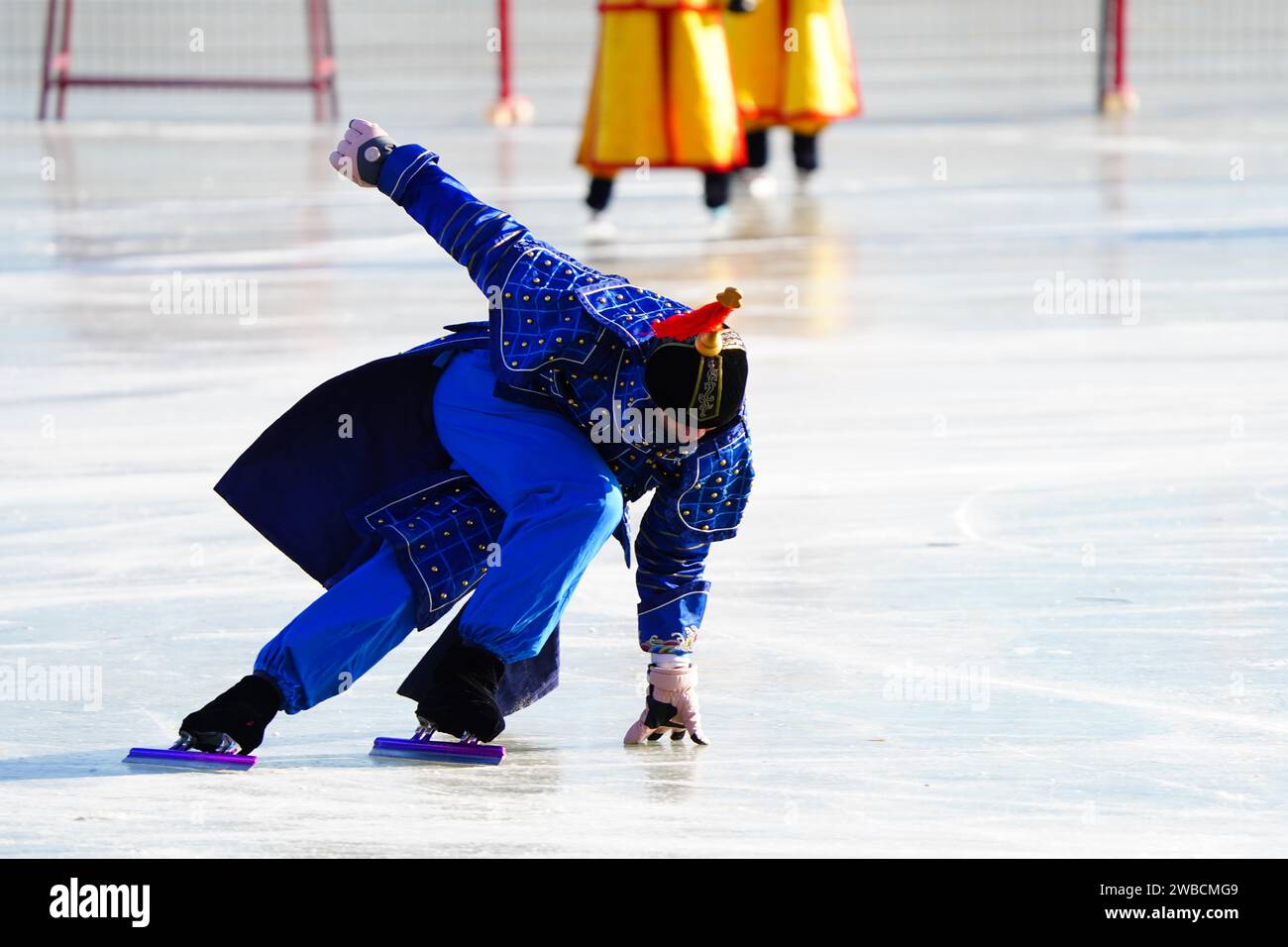 Performers dance on the ice rink in the Old Summer Palace in Beijing ...