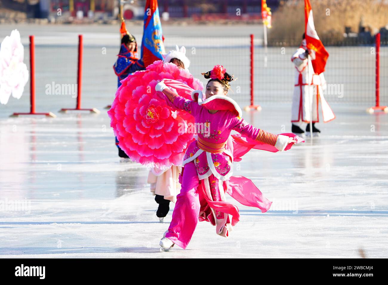 Performers dance on the ice rink in the Old Summer Palace in Beijing ...