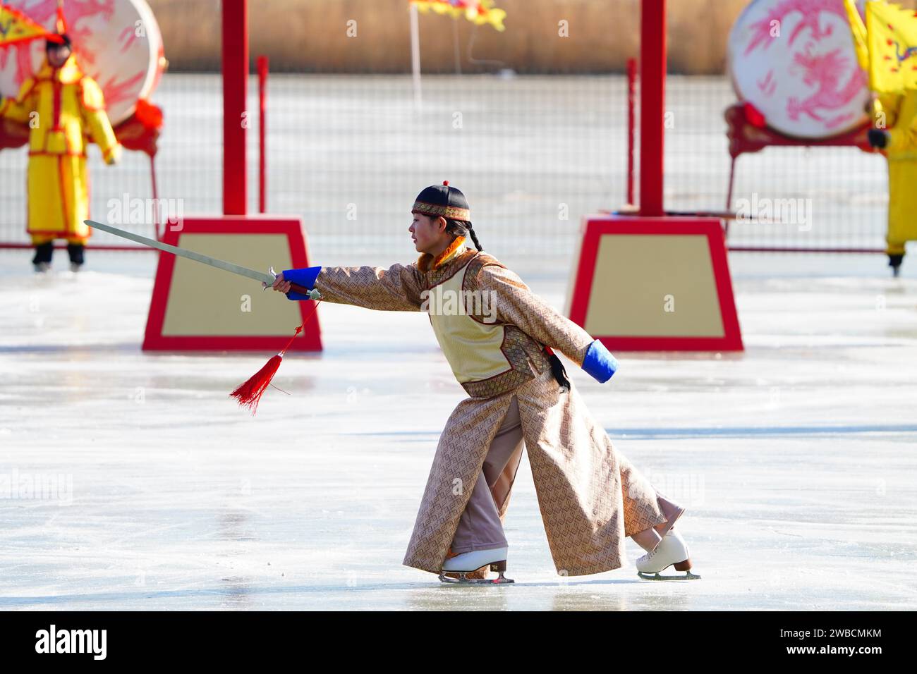 Performers dance on the ice rink in the Old Summer Palace in Beijing ...