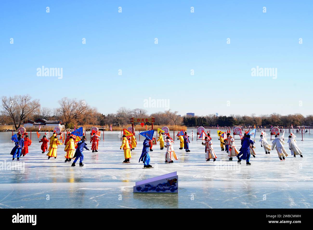 Performers dance on the ice rink in the Old Summer Palace in Beijing ...