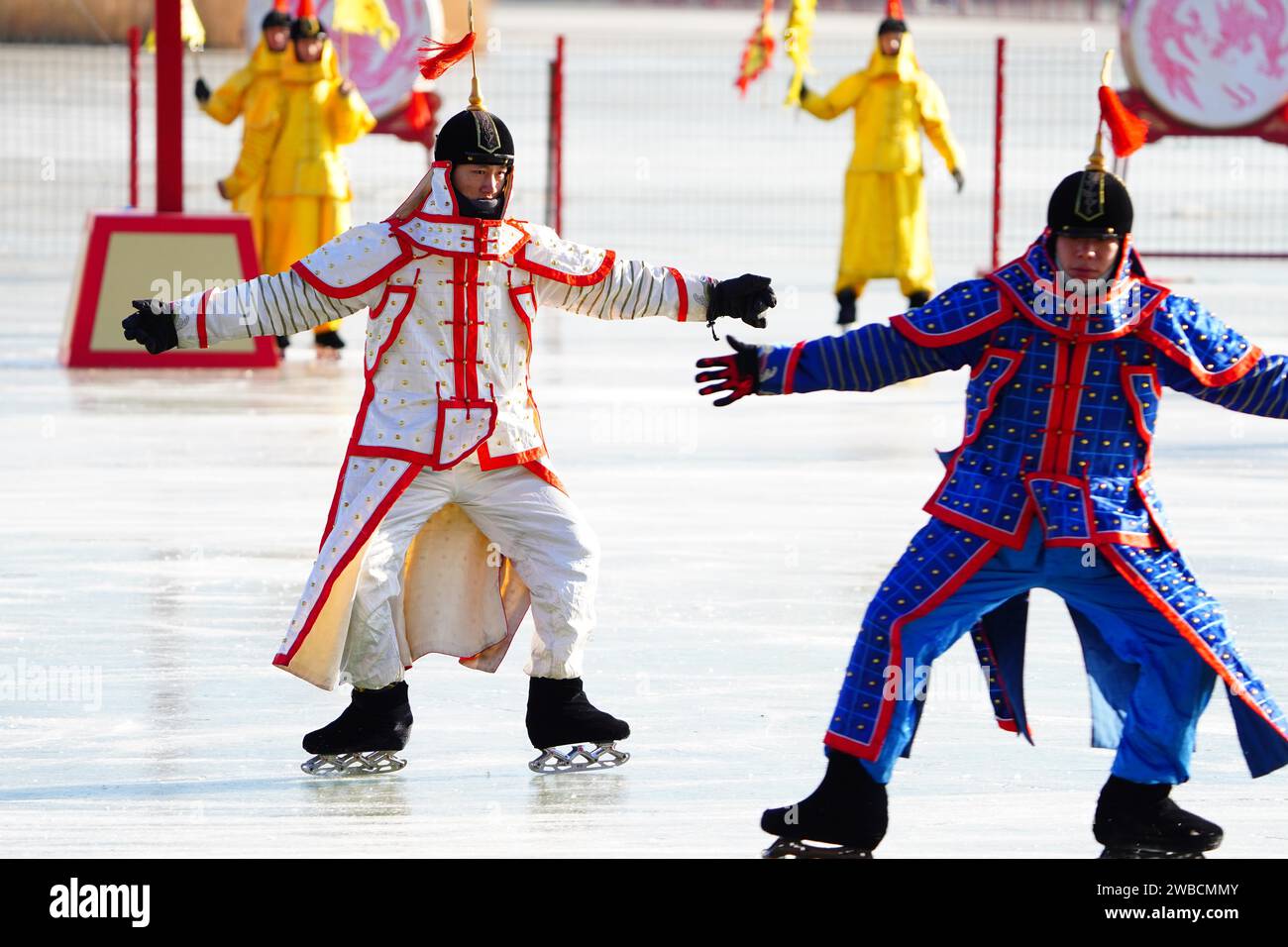 Performers dance on the ice rink in the Old Summer Palace in Beijing ...