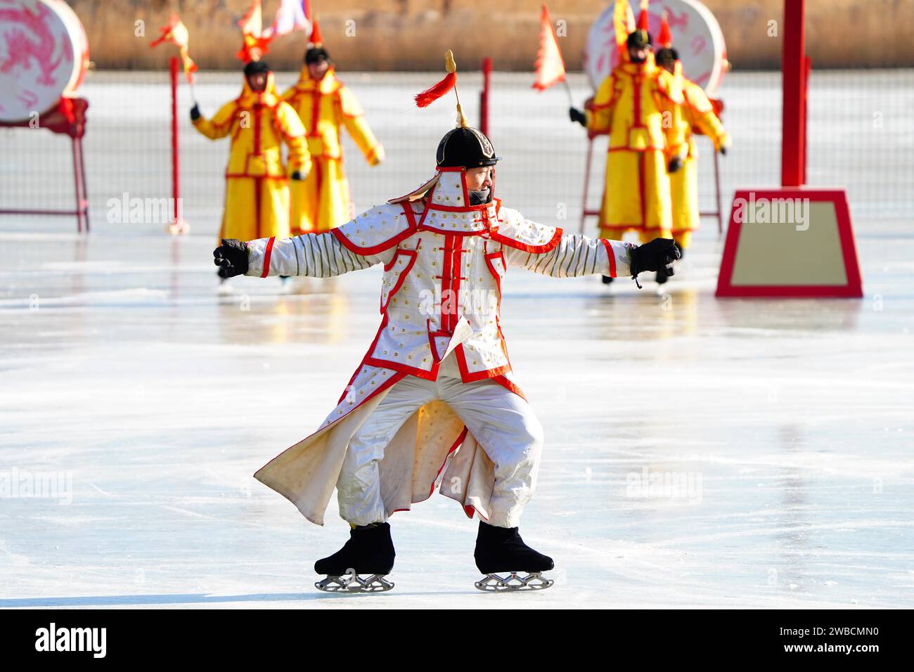 Performers dance on the ice rink in the Old Summer Palace in Beijing ...