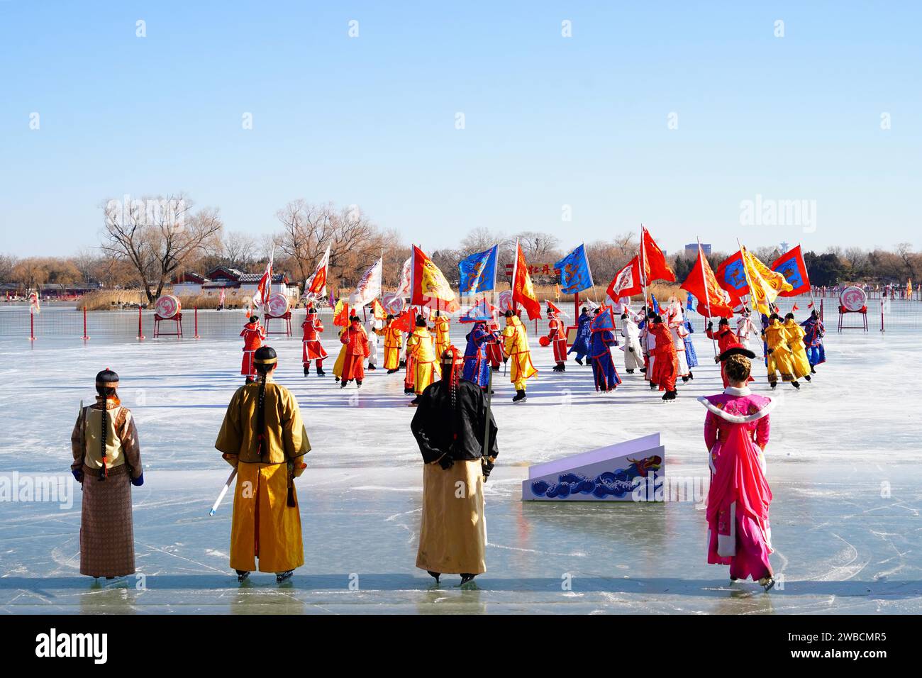 Performers dance on the ice rink in the Old Summer Palace in Beijing ...