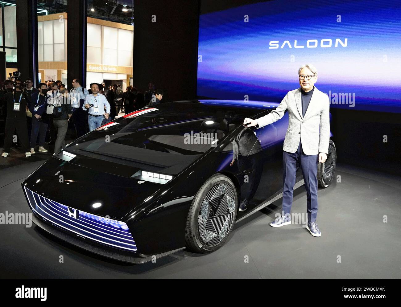 Honda Motor Co. President Toshihiro Mibe stands by the newly unveiled ...