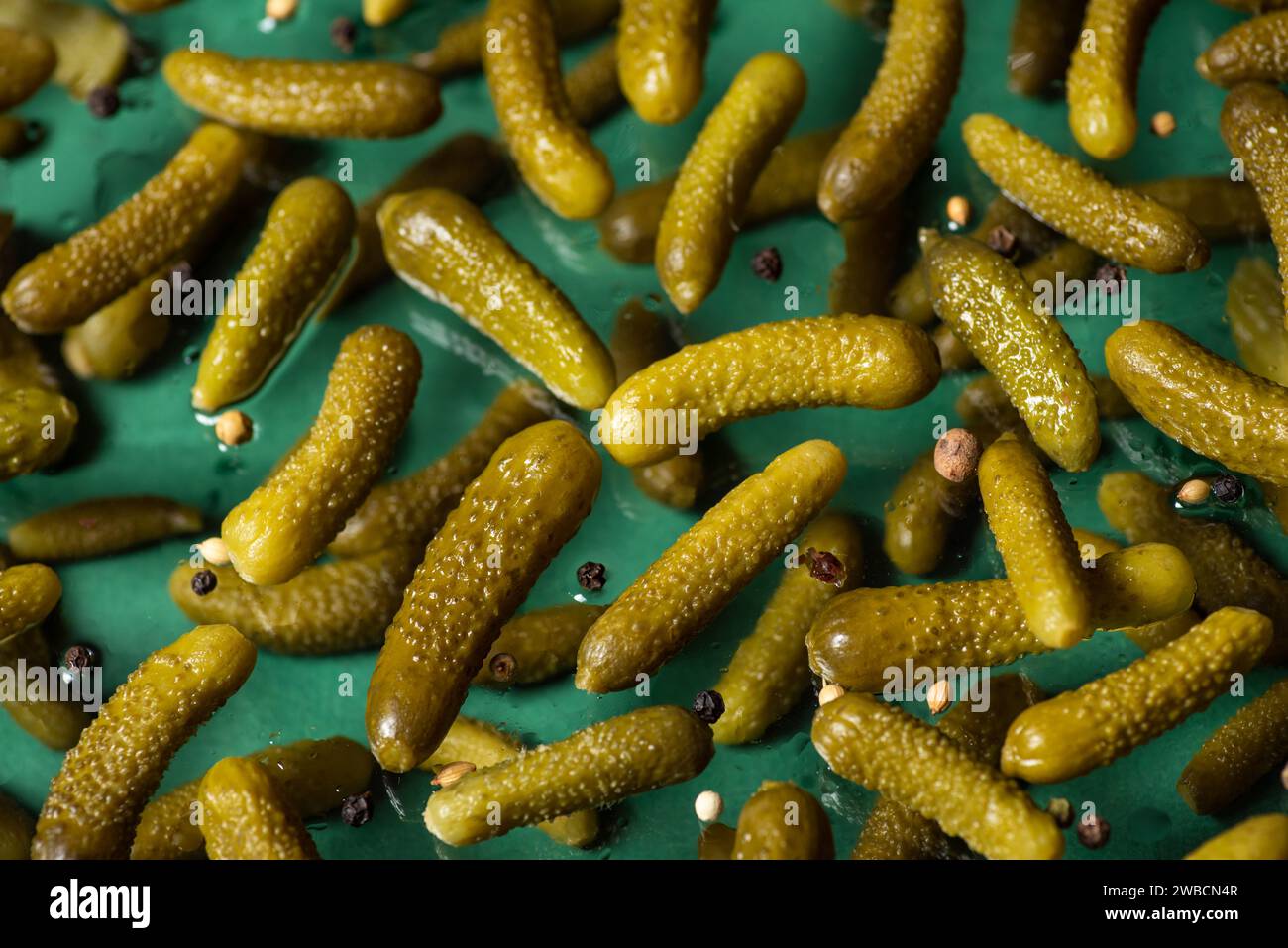 Flying pickles (gherkins) on a green background. 3D stock photo. Top ...