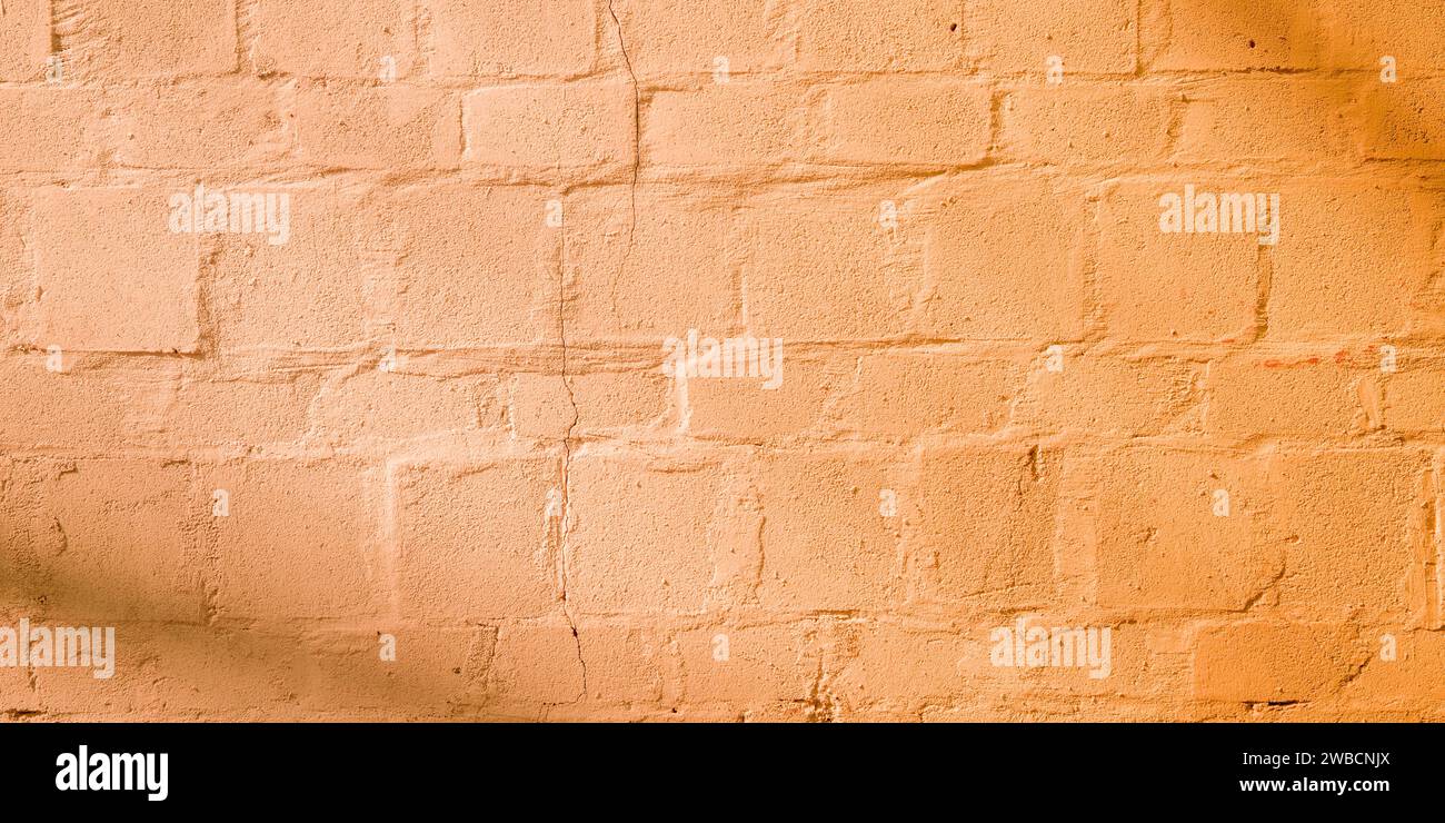 old wall Peach Fuzz beige background with old facade bricks Stock Photo ...