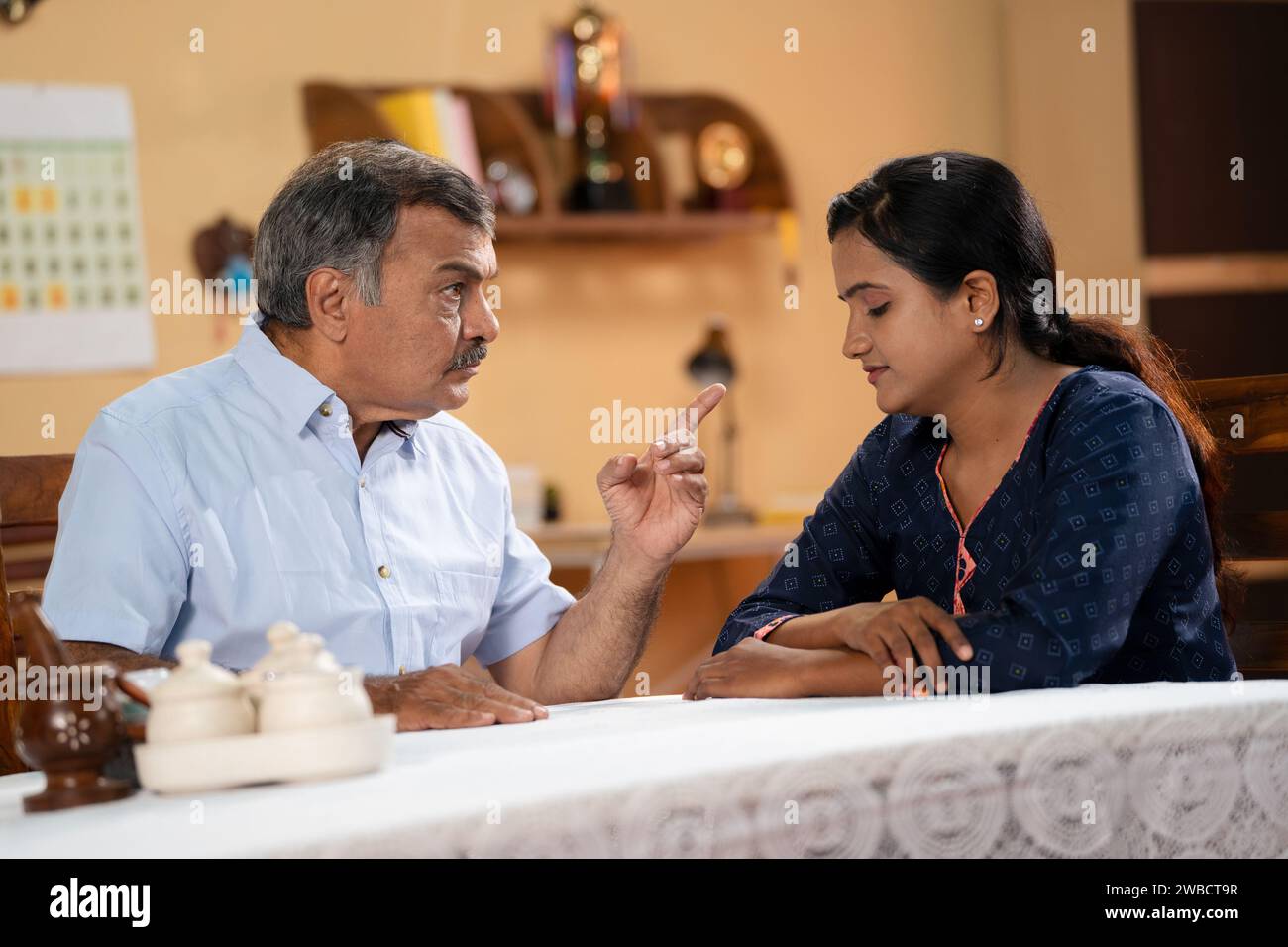 angry Indian father scolding daughter for exam failure or mistakes at ...