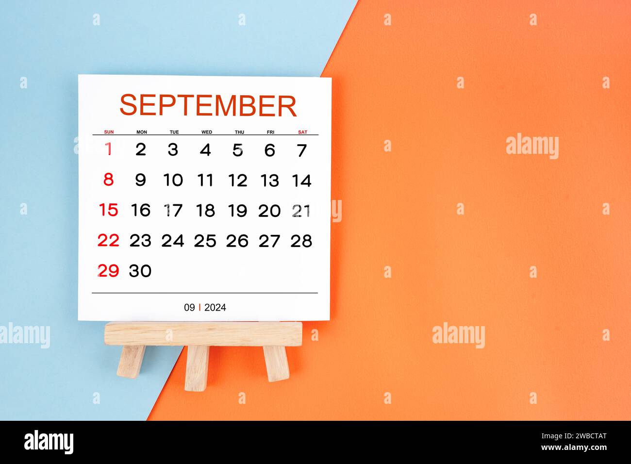 2024 September calendar page on blue and orange color background Stock ...