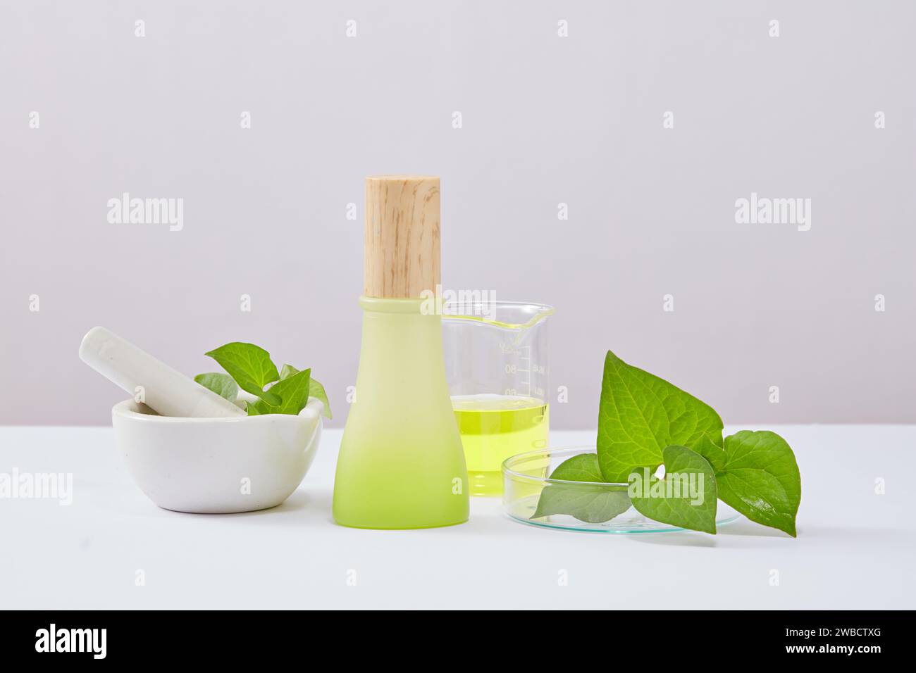 Mockup for product with ingredient from fish mint - glass bottle ...