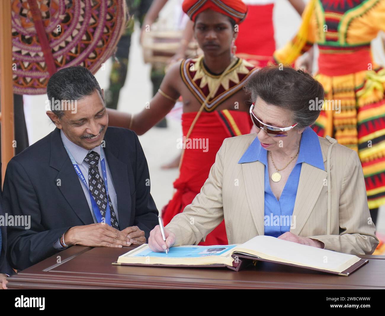 The Princess Royal signs the Golden Book, for VIP visitors, on her ...