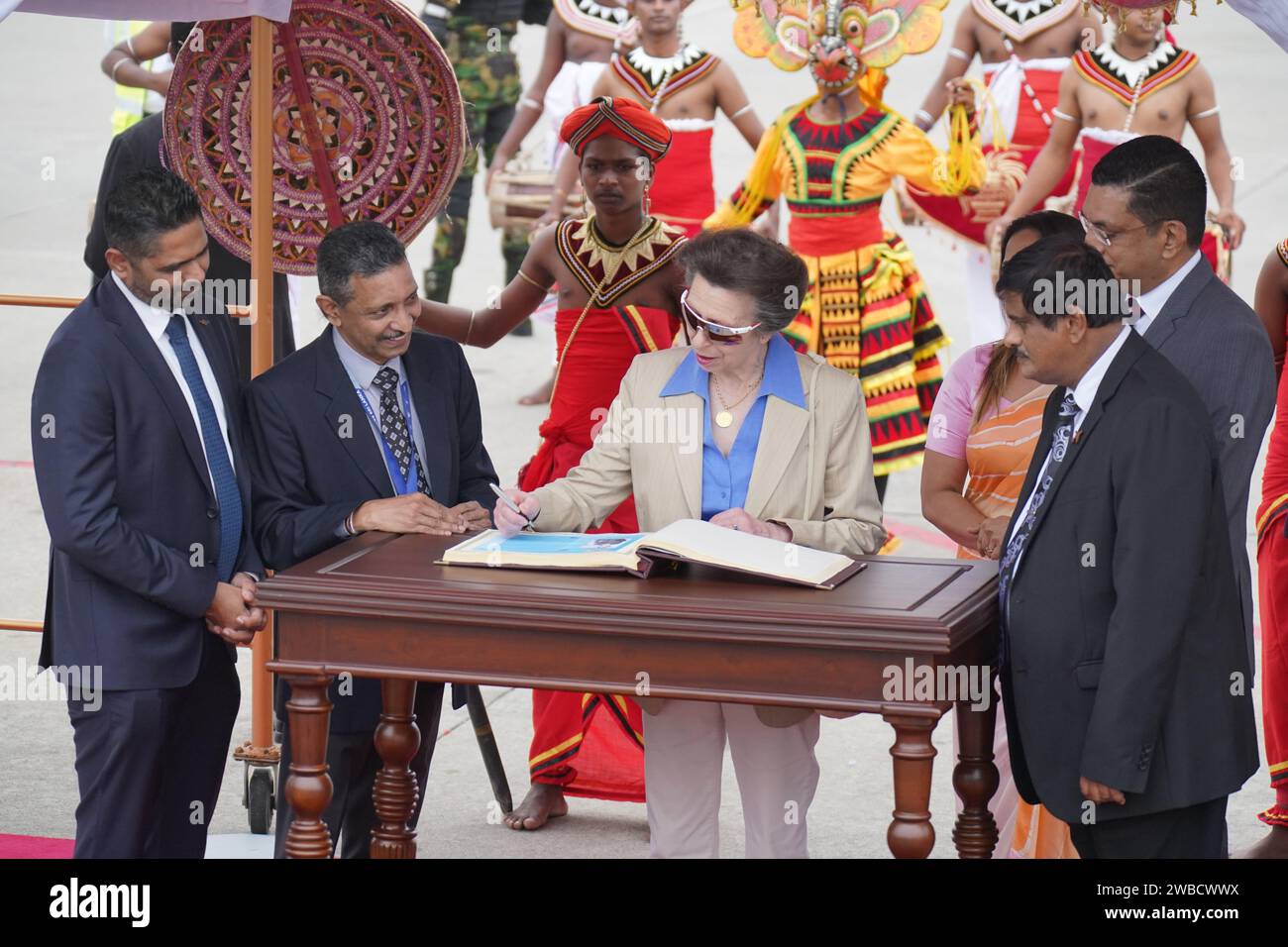 The Princess Royal signs the Golden Book, for VIP visitors, on her ...