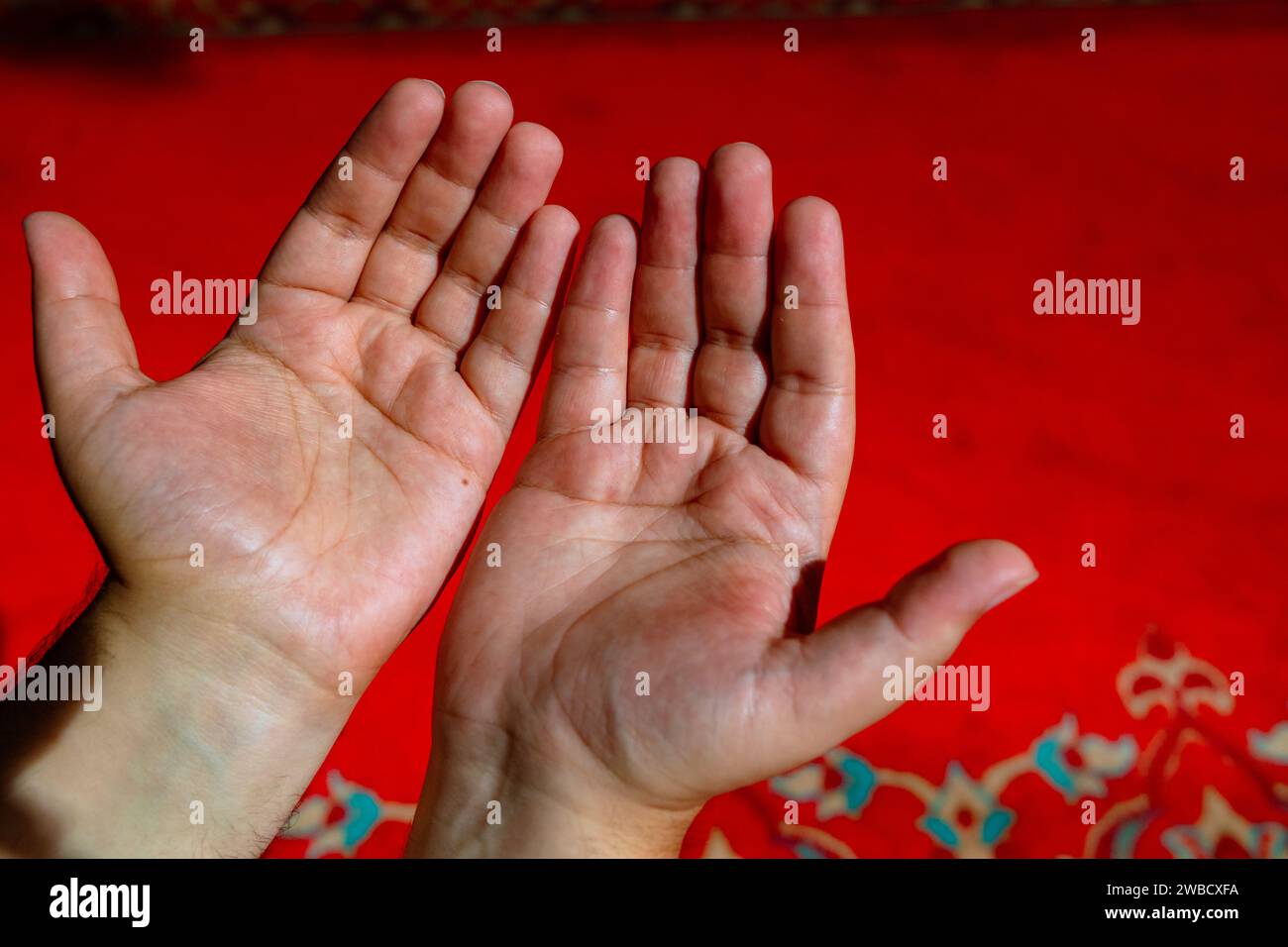 Hands of a muslim man while praying or dua. Islamic concept photo ...