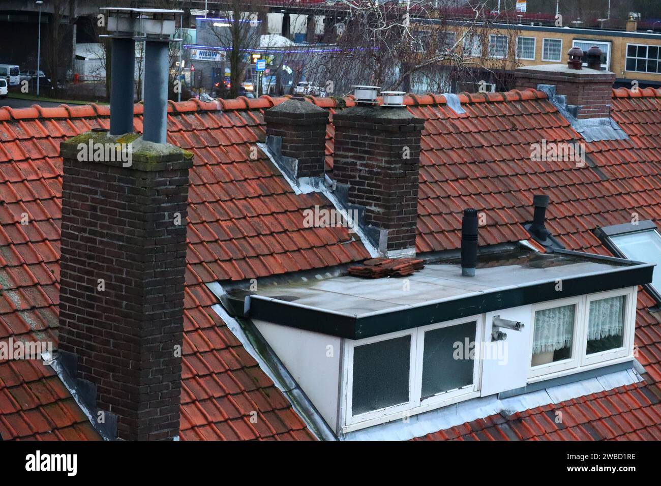 Roof from an old house with windows and chimneys Stock Photo - Alamy