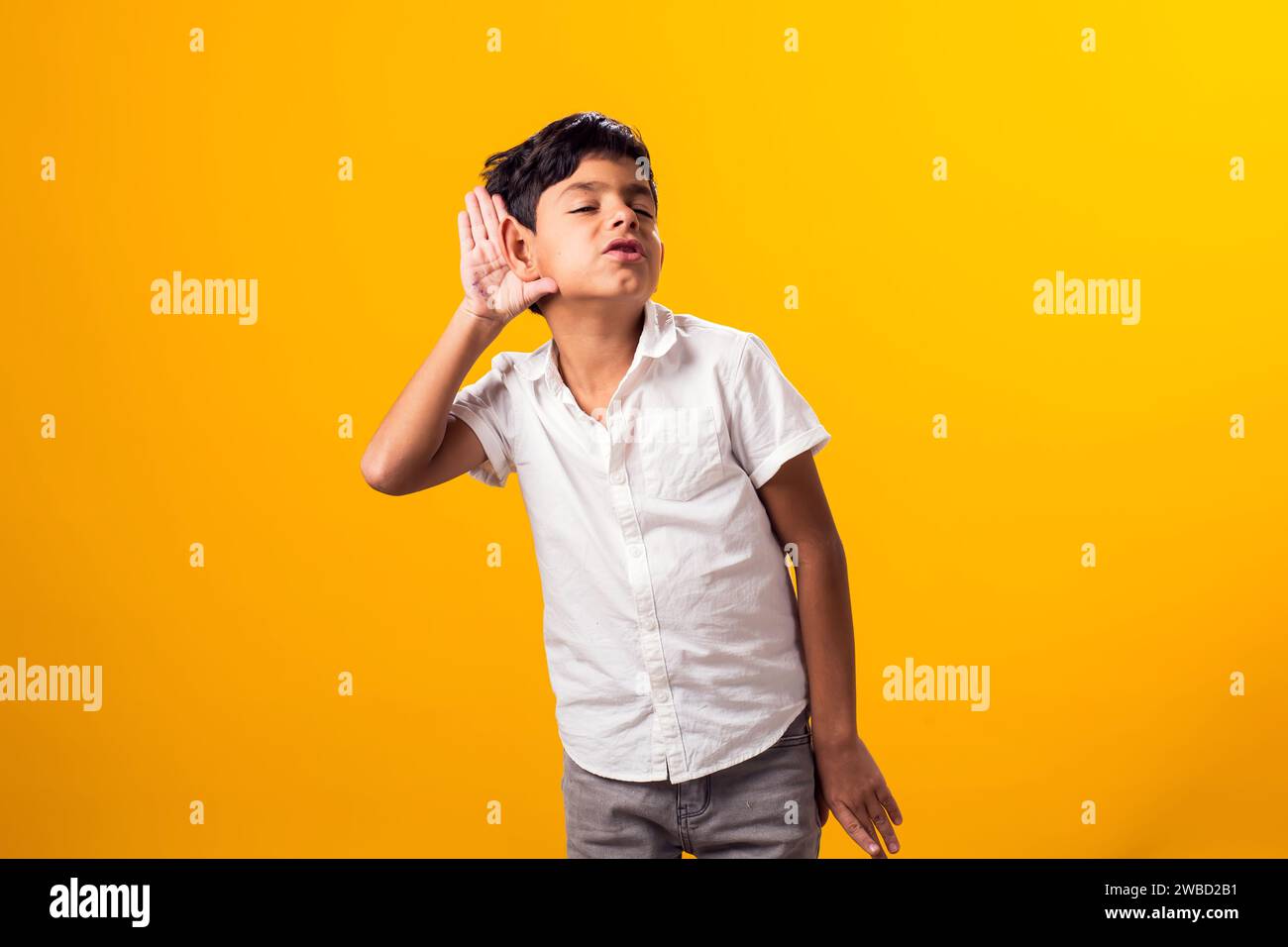 Portrait of kid boy eavesdropping, overhearing confidential secret ...