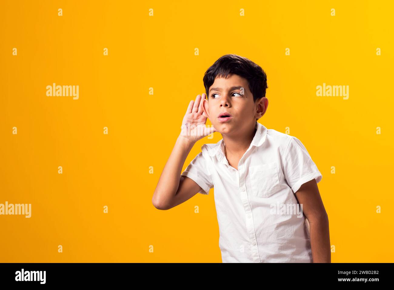 Portrait of kid boy eavesdropping, overhearing confidential secret ...