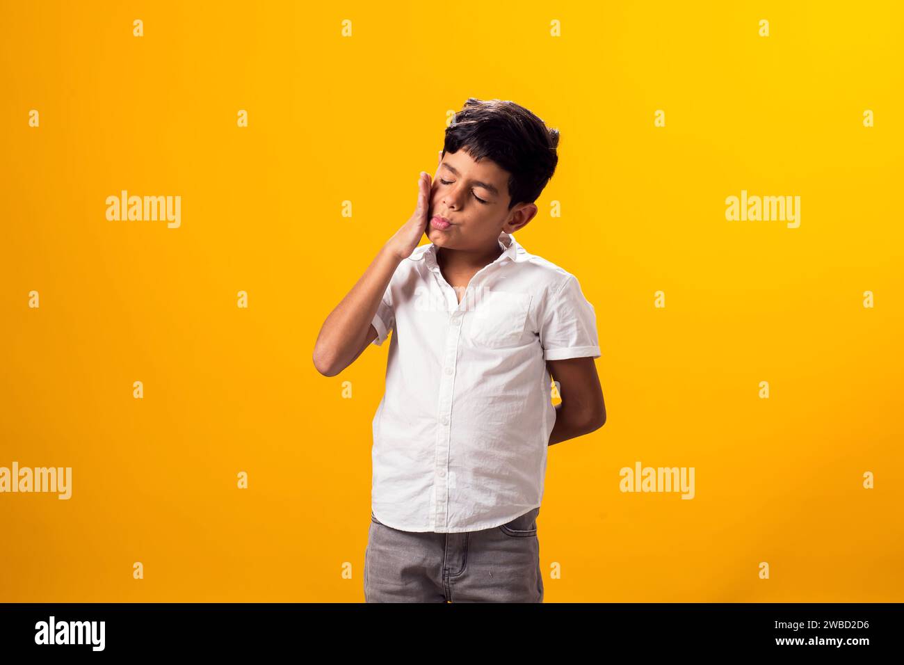 Portrait of kid boy feeling toothache, holding hand on his cheek ...