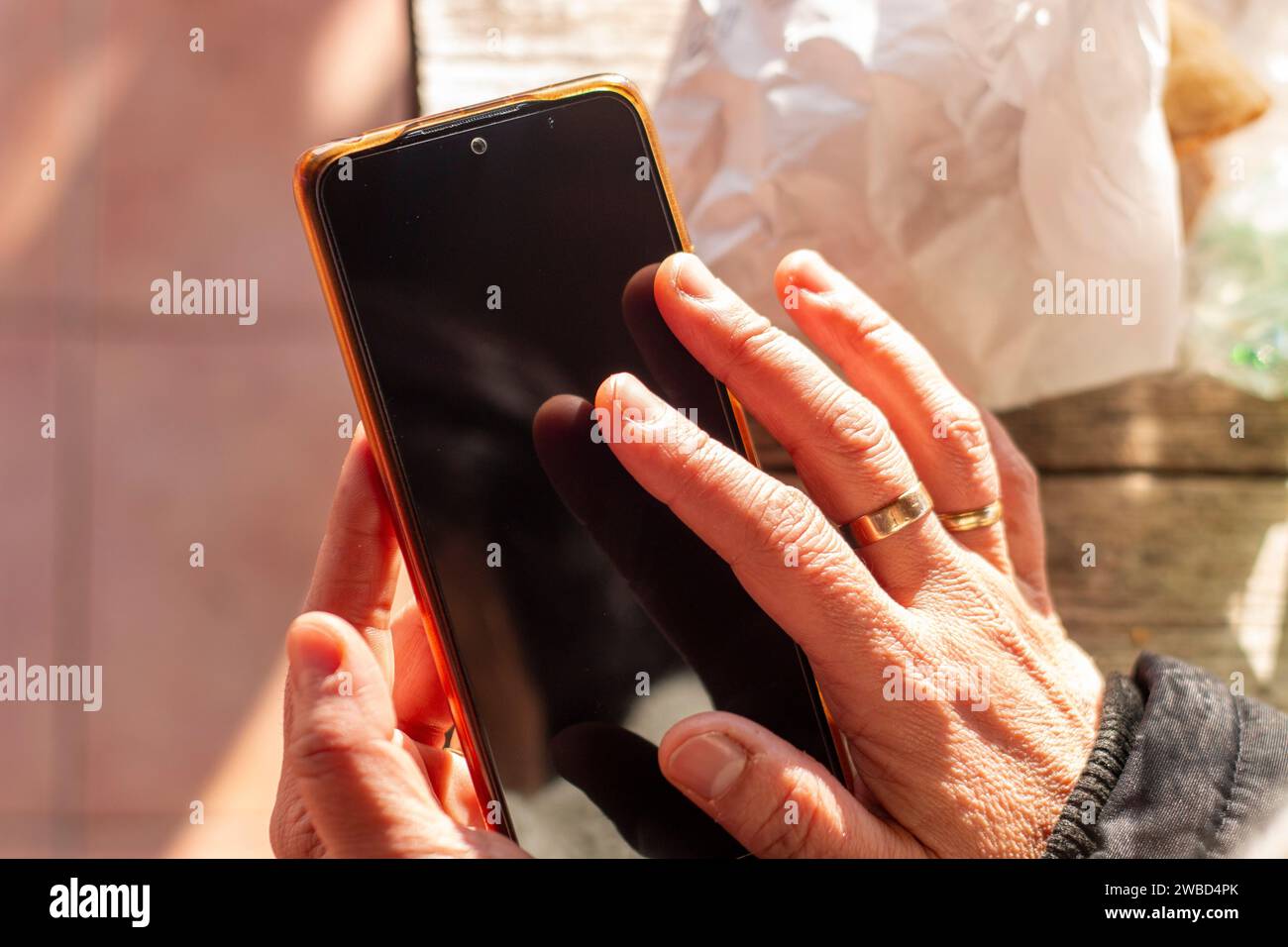 Woman's hand touching the black screen of a mobile phone Stock Photo ...