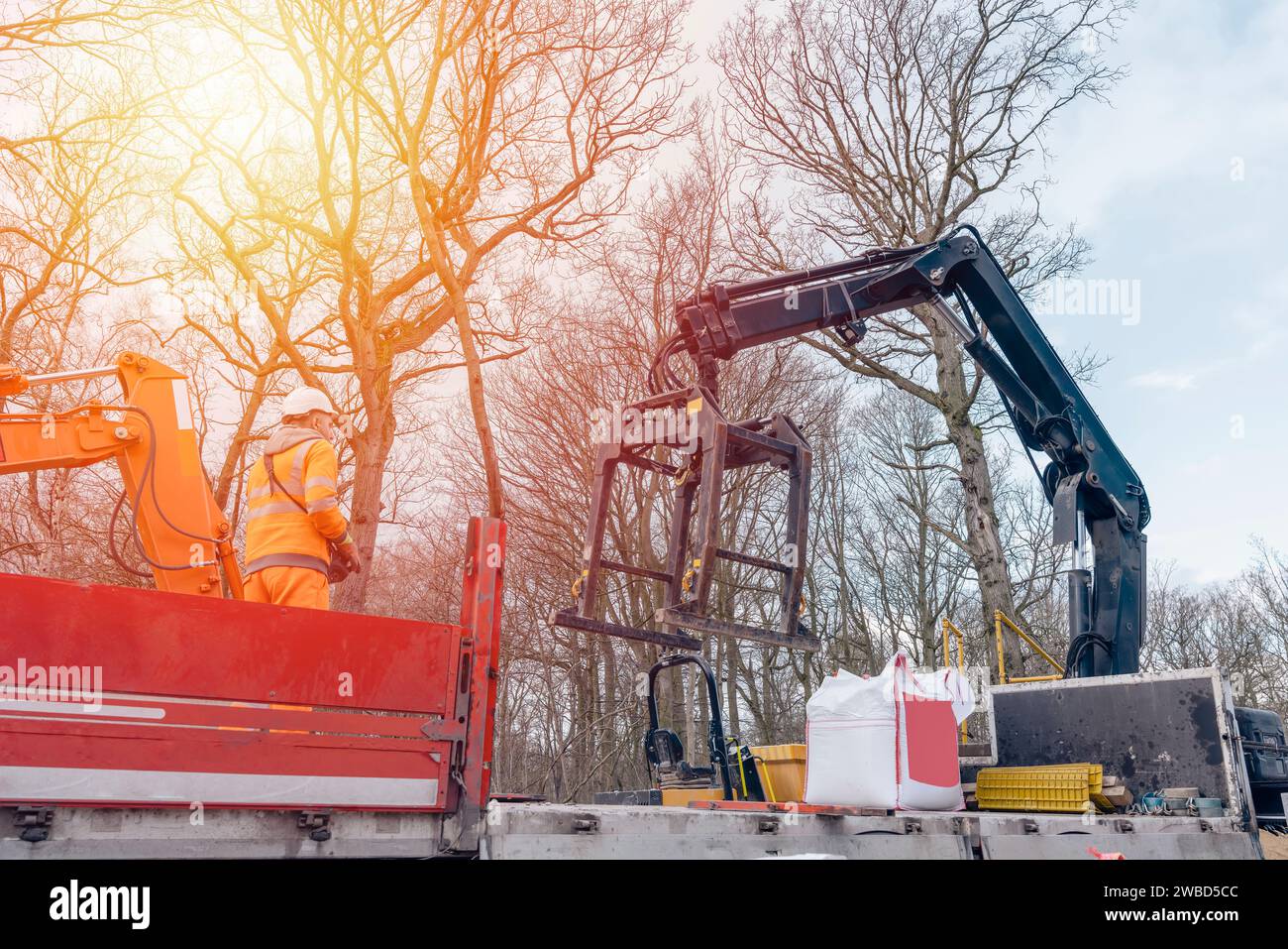 Dropside flatbed HIAB crane lorry with brick grab attachment deliver ...