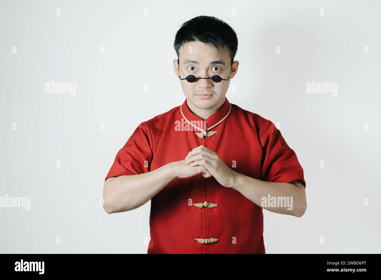 Asian man wearing traditional costume with gesture of congratulations ...