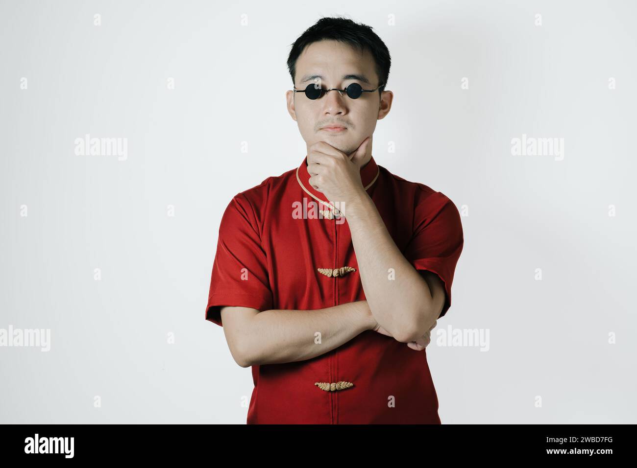 Confused face of Asian man wearing traditional costume on white ...